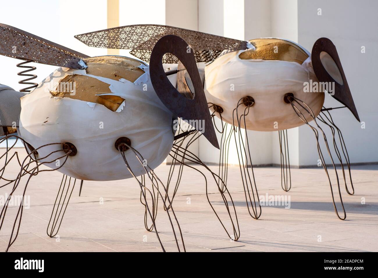 Metal sculptures of giant flies outside the Bahrain Fort museum Stock ...