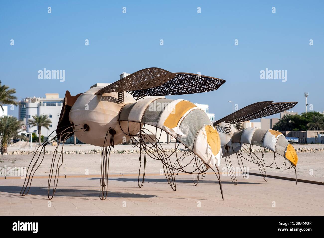 Metal sculptures of giant flies outside the Bahrain Fort museum Stock ...