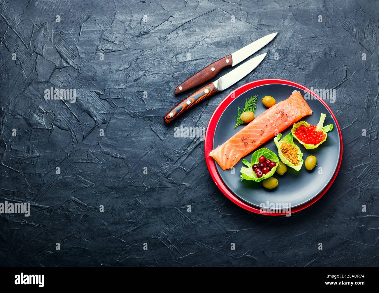 Salted salmon with red caviar,olive and cranberries.Salmon fillets.Copy ...