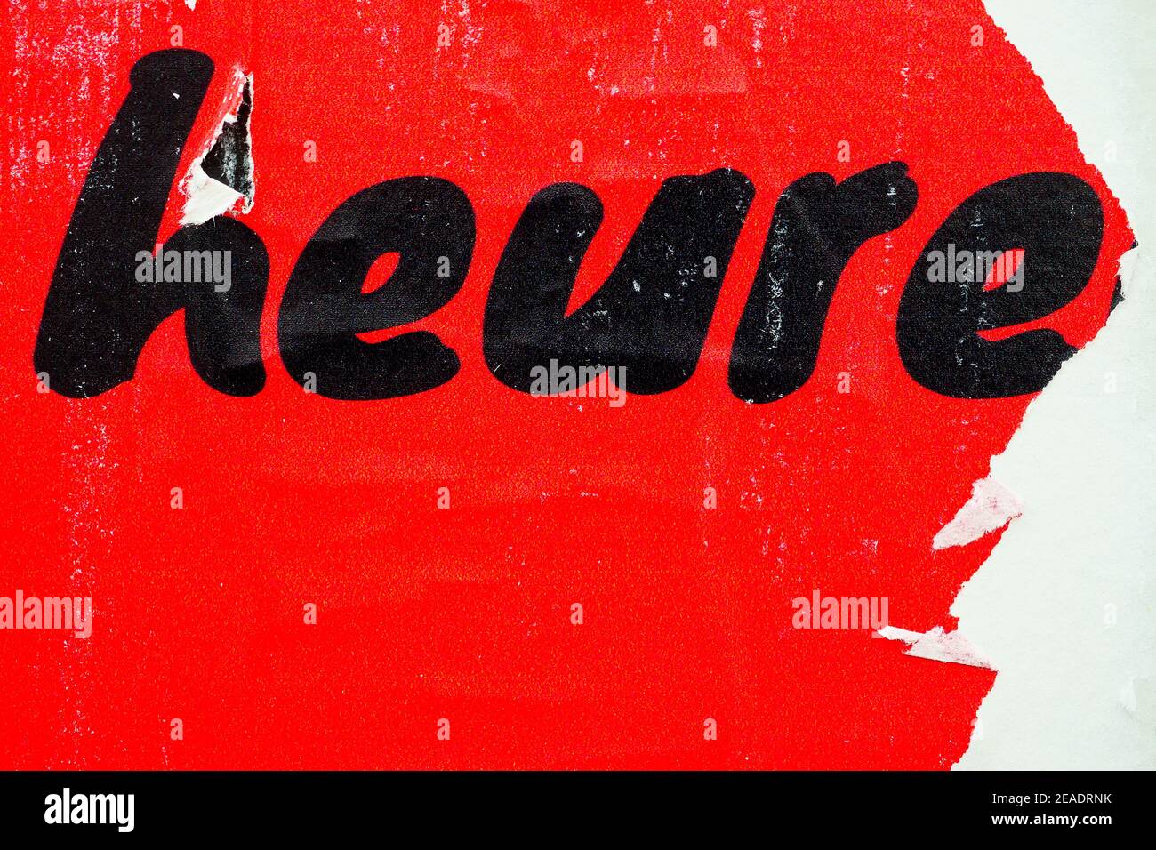 "Hours", word written on a torn political poster, Lyon, France Stock ...