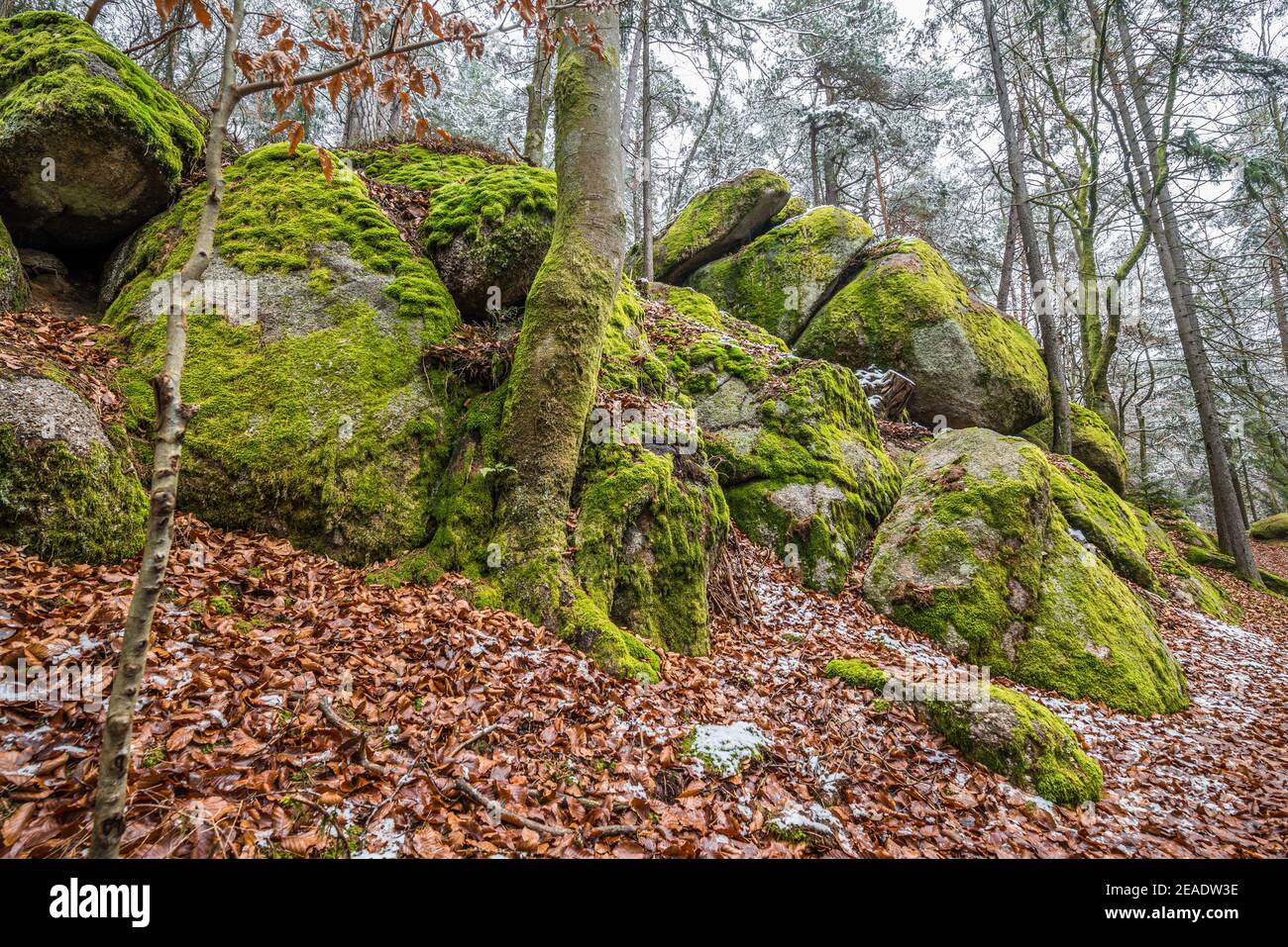 Ancient weathered megalithic granite rock formation with cave and ...