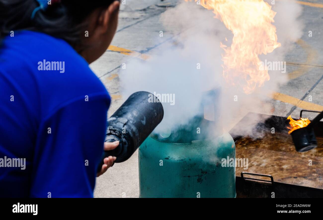 Employees firefighting training,Extinguish a fire Stock Photo - Alamy