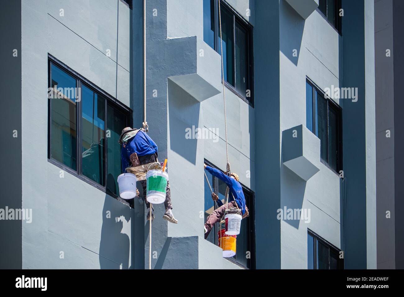 Hanging wall painter with roller hi-res stock photography and images ...