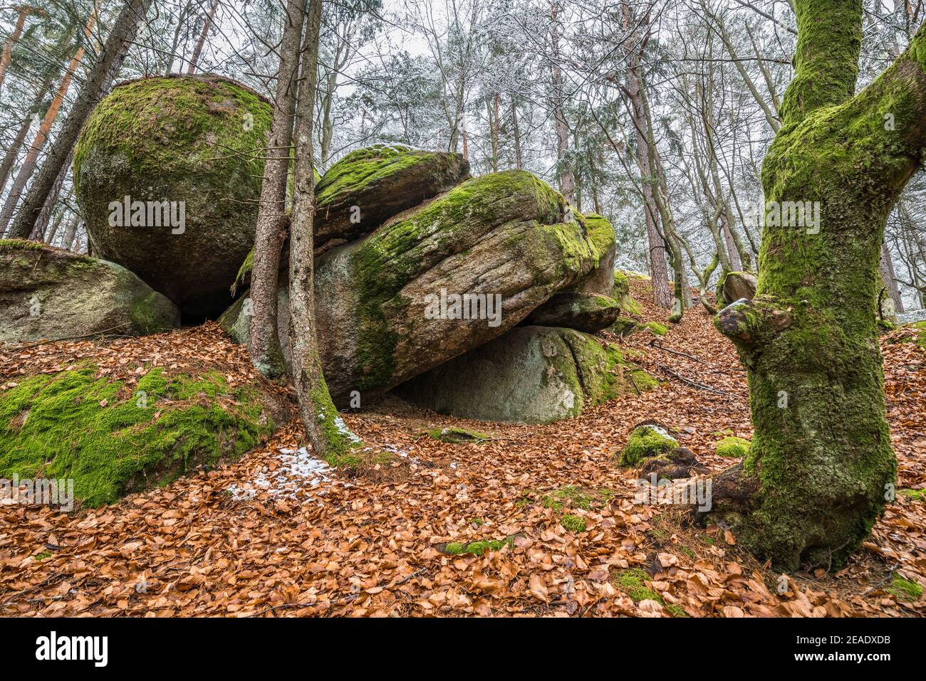 Ancient weathered megalithic granite rock formation with cave and ...