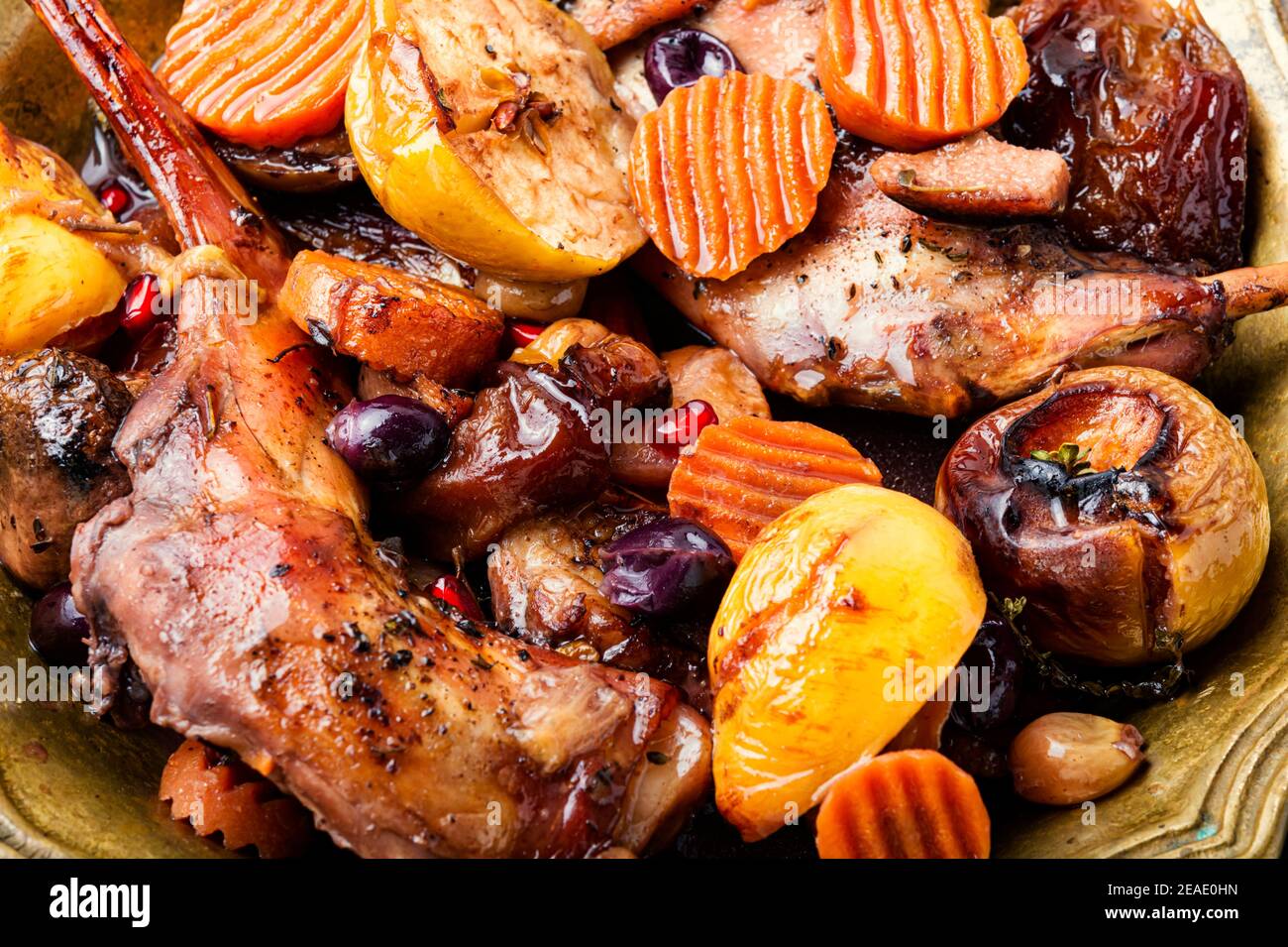 Delicious baked rabbit meat with fruits.Food background,macro Stock ...