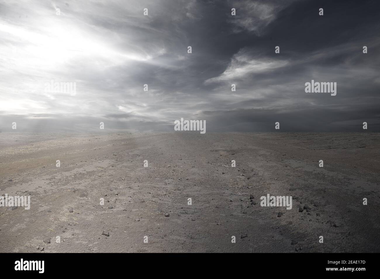 Drought land with a dark sky background Stock Photo - Alamy
