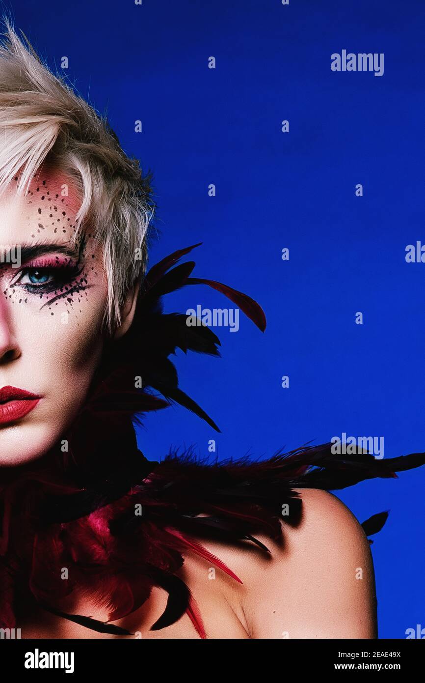 Female Caucasian model with avant-garde look, beautiful striking makeup ...