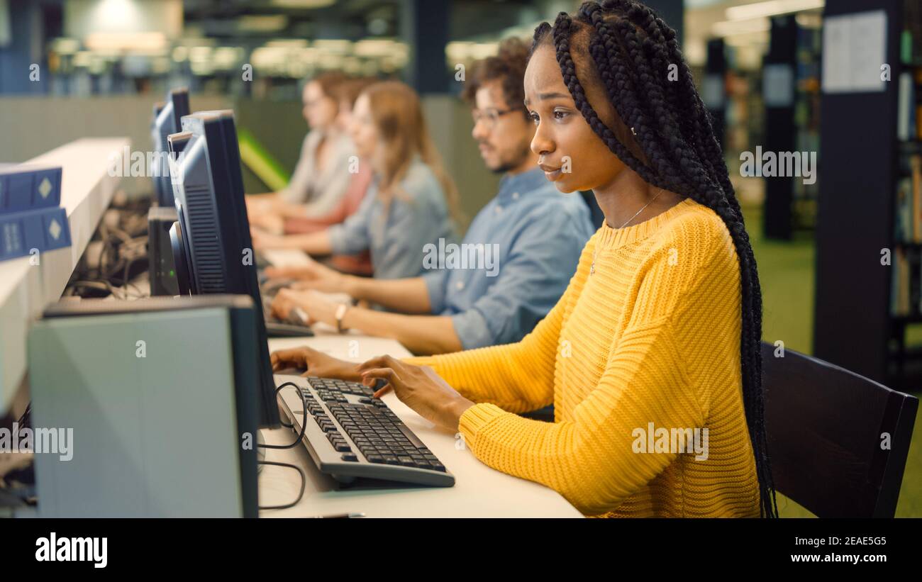 University Library: Gifted Beautiful Black Girl using Computer for ...