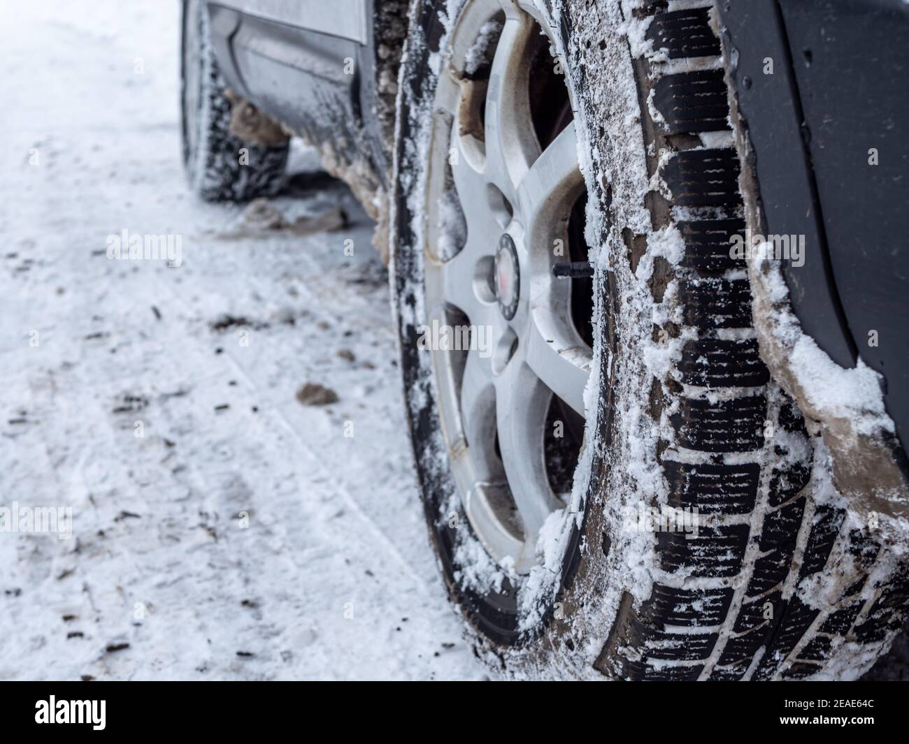 Winter tires with tread in the snow Stock Photo - Alamy