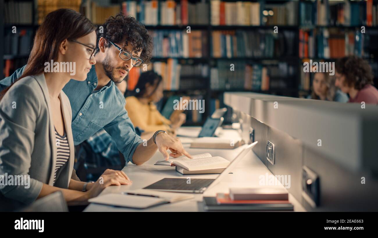 University Library: Talented Caucasian Girl uses Laptop, Smart Helpful ...