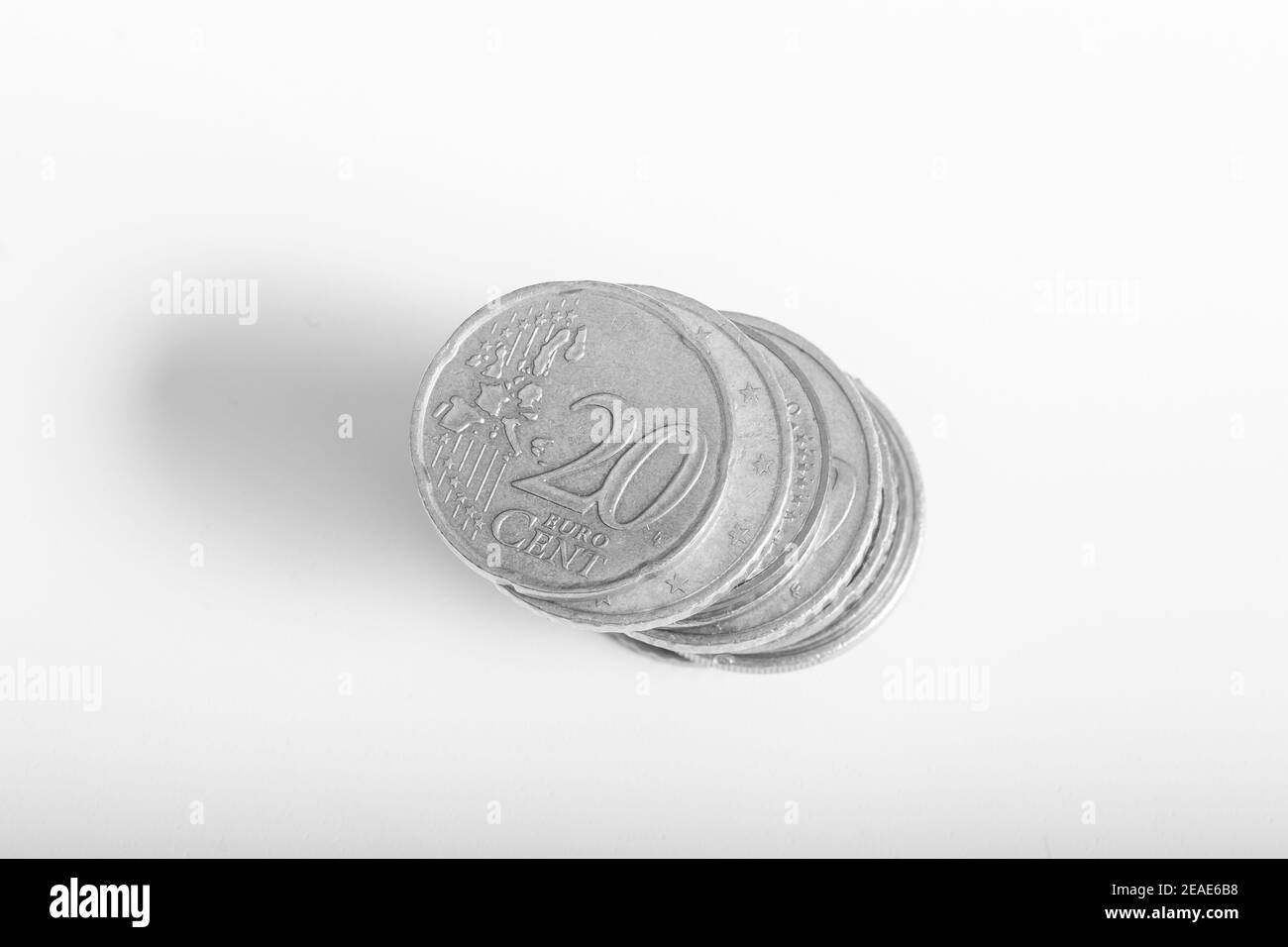 Coins cash money in piles, Isolated on white background Stock Photo - Alamy