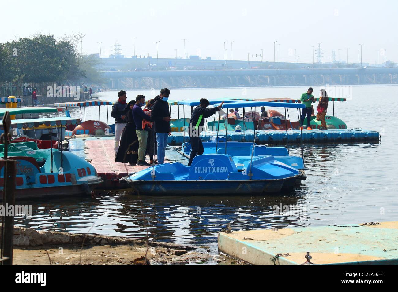 People at the Bhalswa Lake Boat Club in Delhi, India during a winter ...