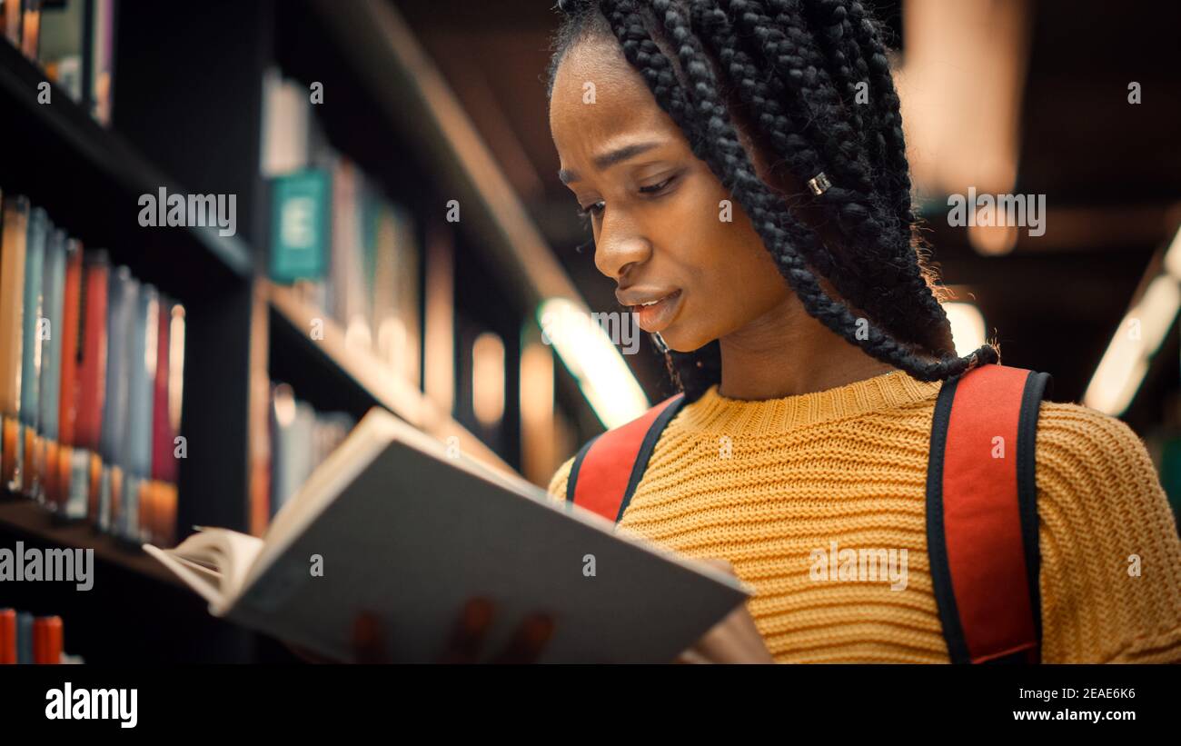 University Library: Smart Beautiful Black Girl Standing Next to ...