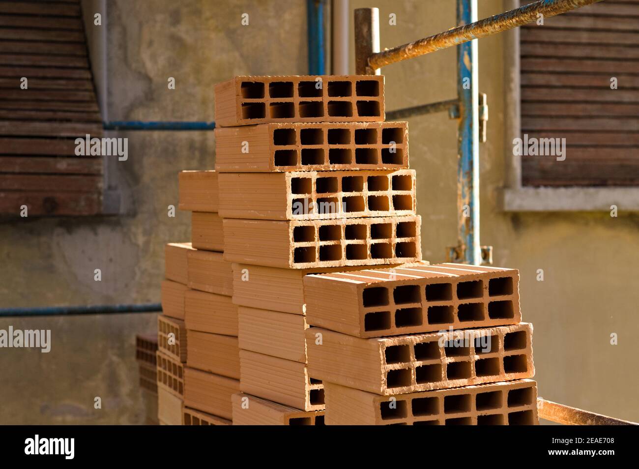 Hollow construction bricks stacked on a construction site on the ...