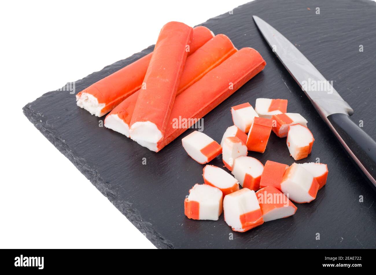 Surimi, crab sticks, slices of fresh green cucumber. Studio Photo Stock ...