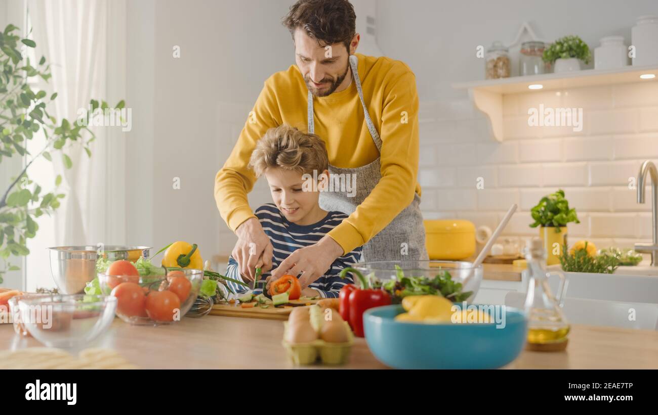 In the Kitchen: Father and Cute Little Son Cooking Together Healthy ...