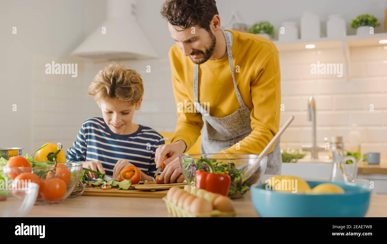 In the Kitchen: Father and Cute Little Son Cooking Together Healthy ...