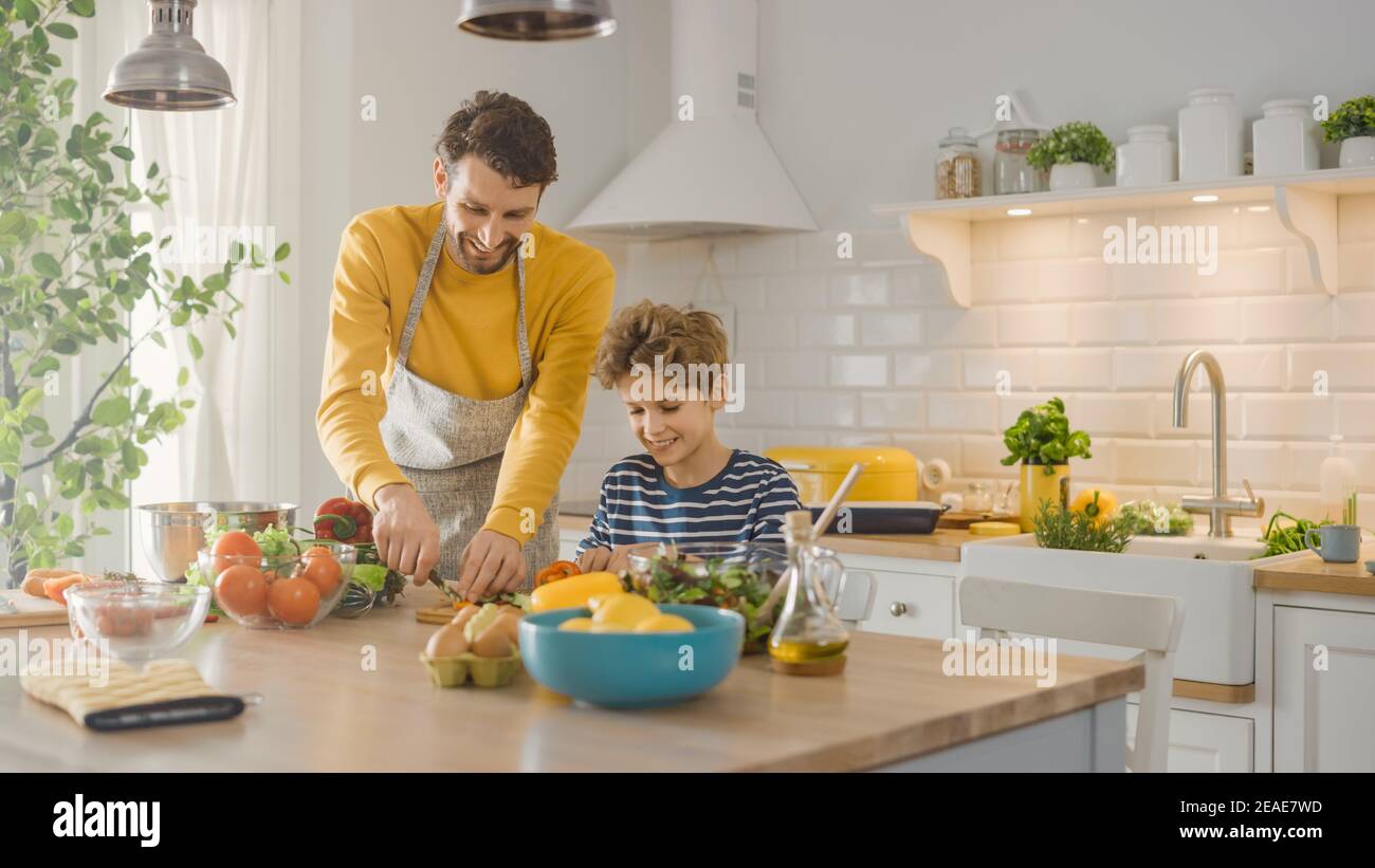 In the Kitchen: Father and Cute Little Son Cooking Together Healthy ...