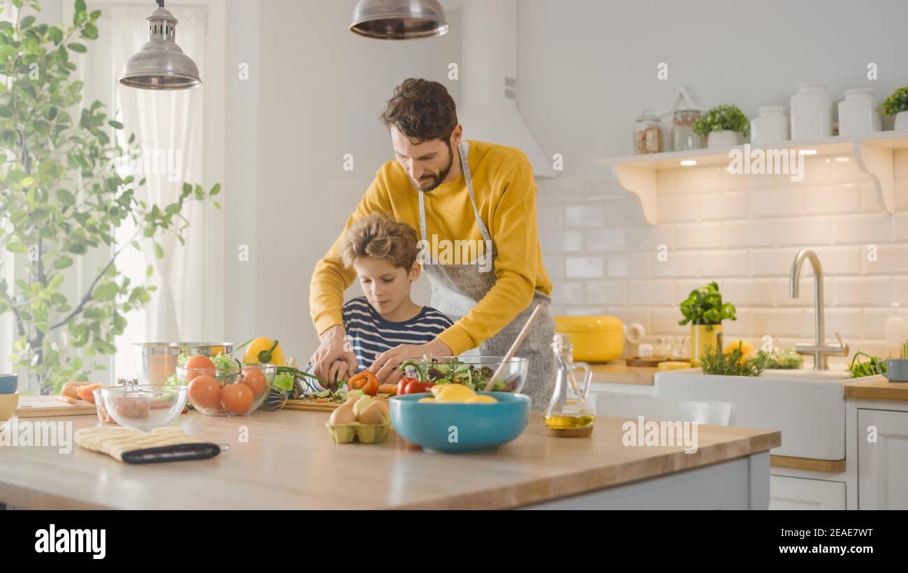 In the Kitchen: Father and Cute Little Son Cooking Together Healthy ...