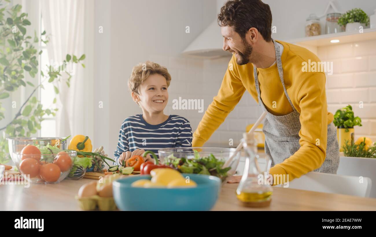 In the Kitchen: Father and Cute Little Son Cooking Together Healthy ...