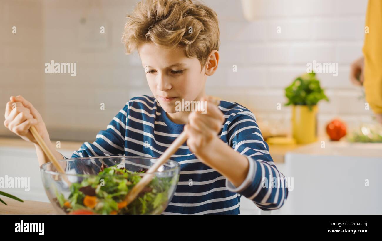 In Kitchen: Little Boy Cooking Together Healthy Dinner. Son Studies ...