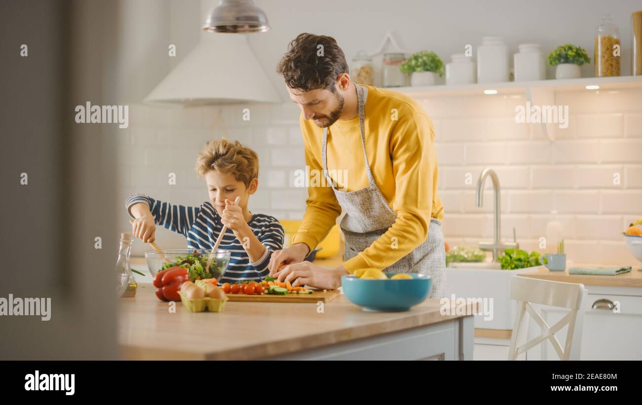 In Kitchen: Father and Cute Little Boy Cooking Together Healthy Dinner ...