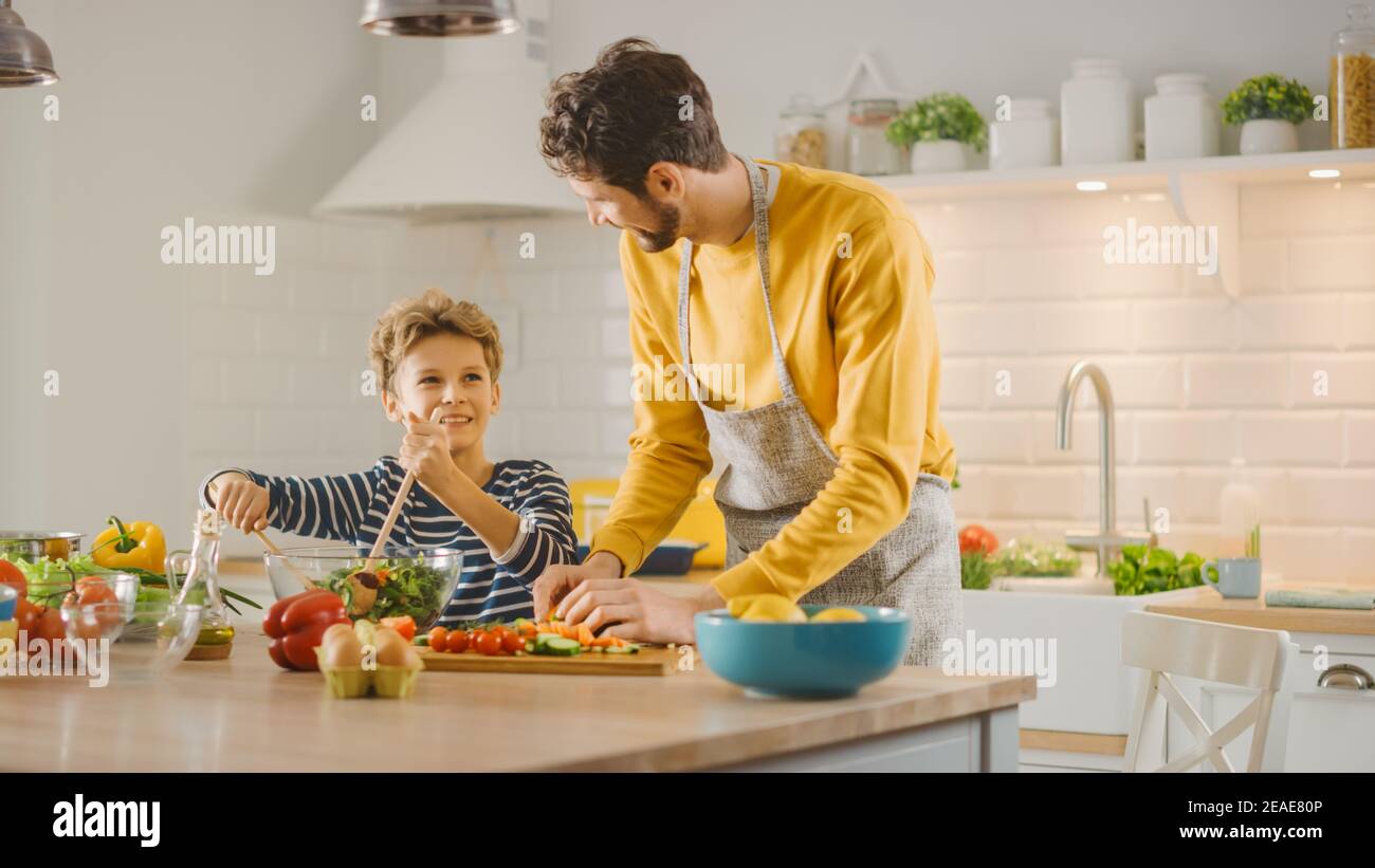 In Kitchen: Father and Cute Little Boy Cooking Together Healthy Dinner ...
