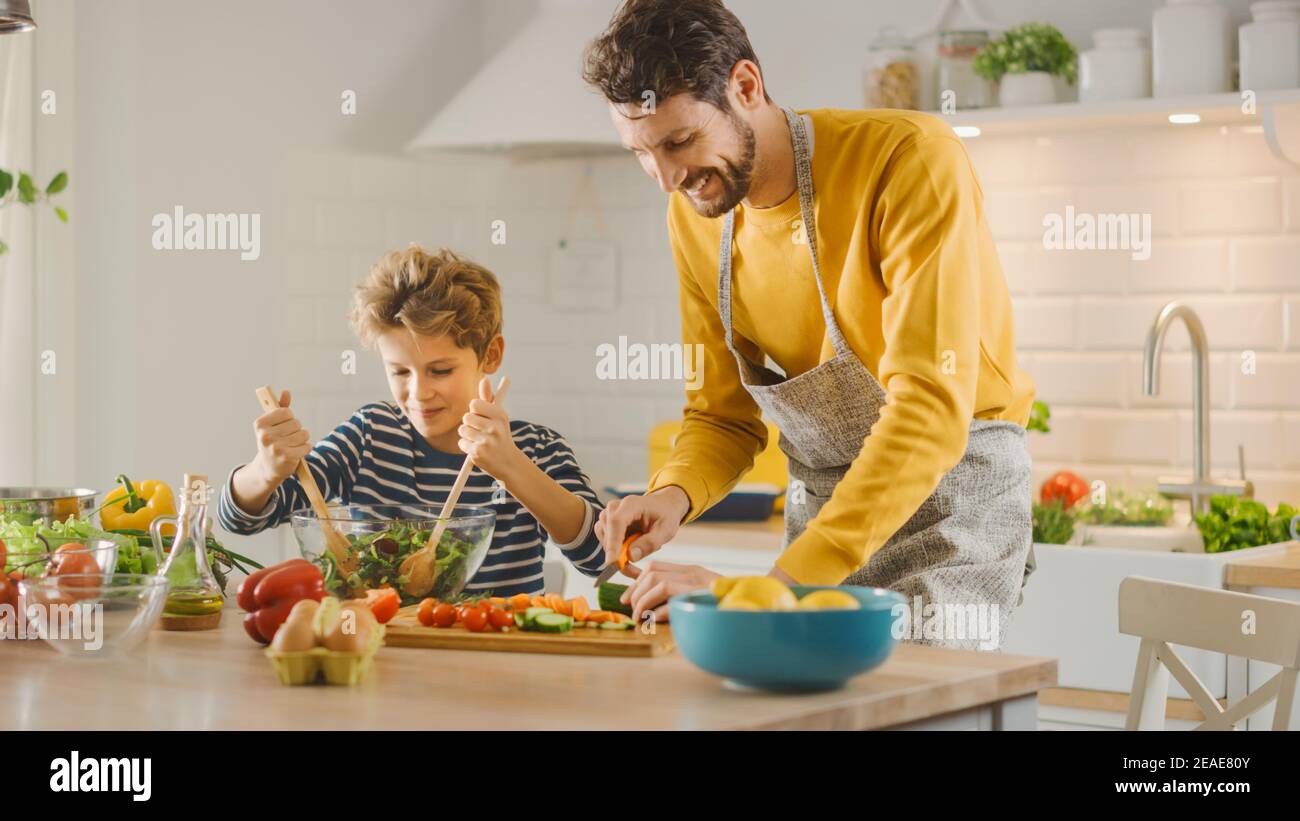 In Kitchen: Father and Cute Little Boy Cooking Together Healthy Dinner ...
