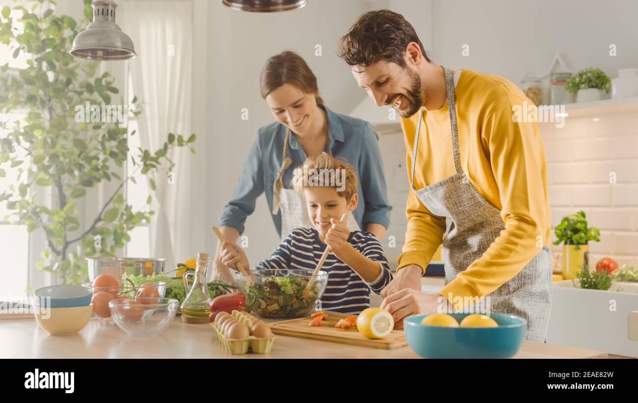 In the Kitchen: Mother, Father and Cute Little Boy Cooking Together ...