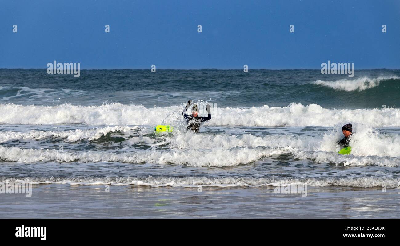 CULLEN BAY MORAY FIRTH SCOTLAND A SNOWY FEBRUARY MORNING WITH TWO ...