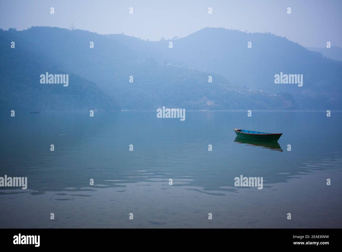 Colorful wooden boat in Phewa Lake. Pokhara. Nepal Stock Photo - Alamy