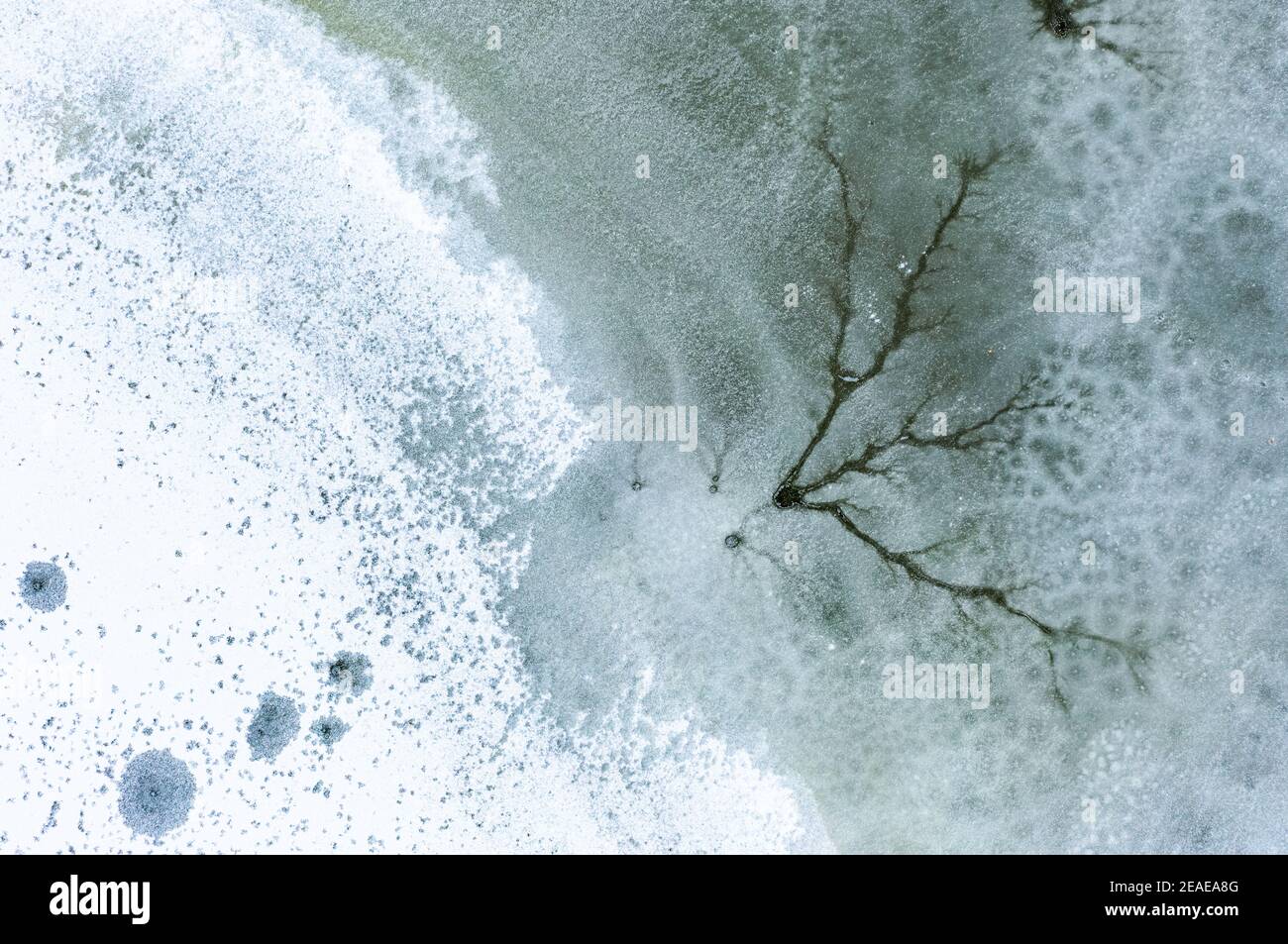 Aerial view of frozen lake. Aerial photography during winter season ...