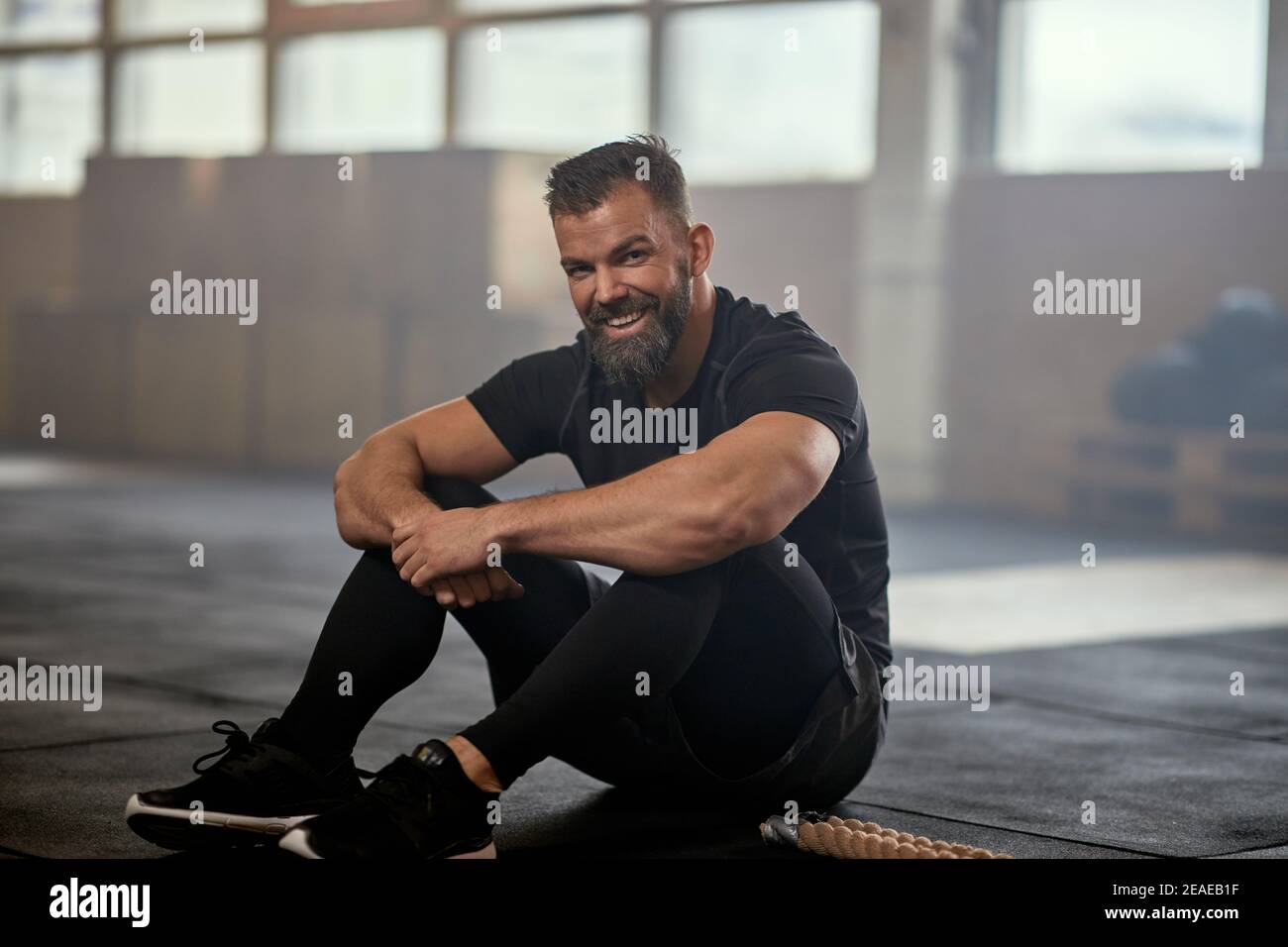 Muscular man sitting on floor hi-res stock photography and images - Alamy