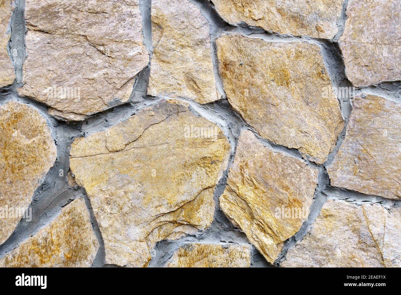 shaped stone wall creation, in various shades of brown. wallpaper ...