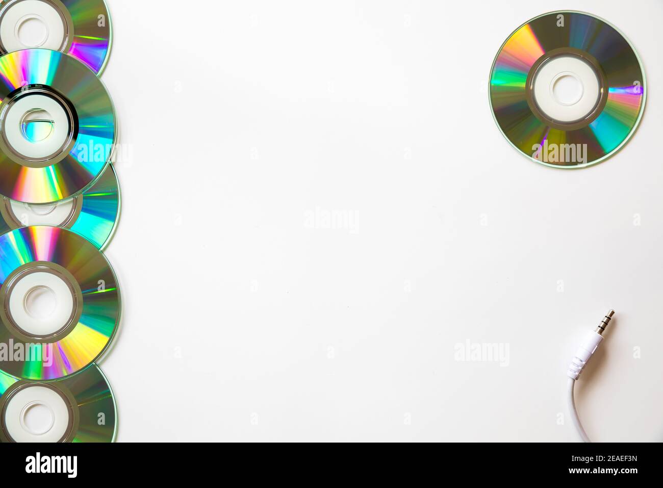 Several DVDs isolated on white background with a jack connector Stock ...