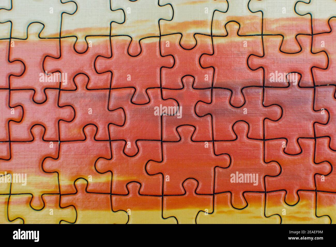 Completed vibrant red puzzle pieces background for connection, teamwork ...