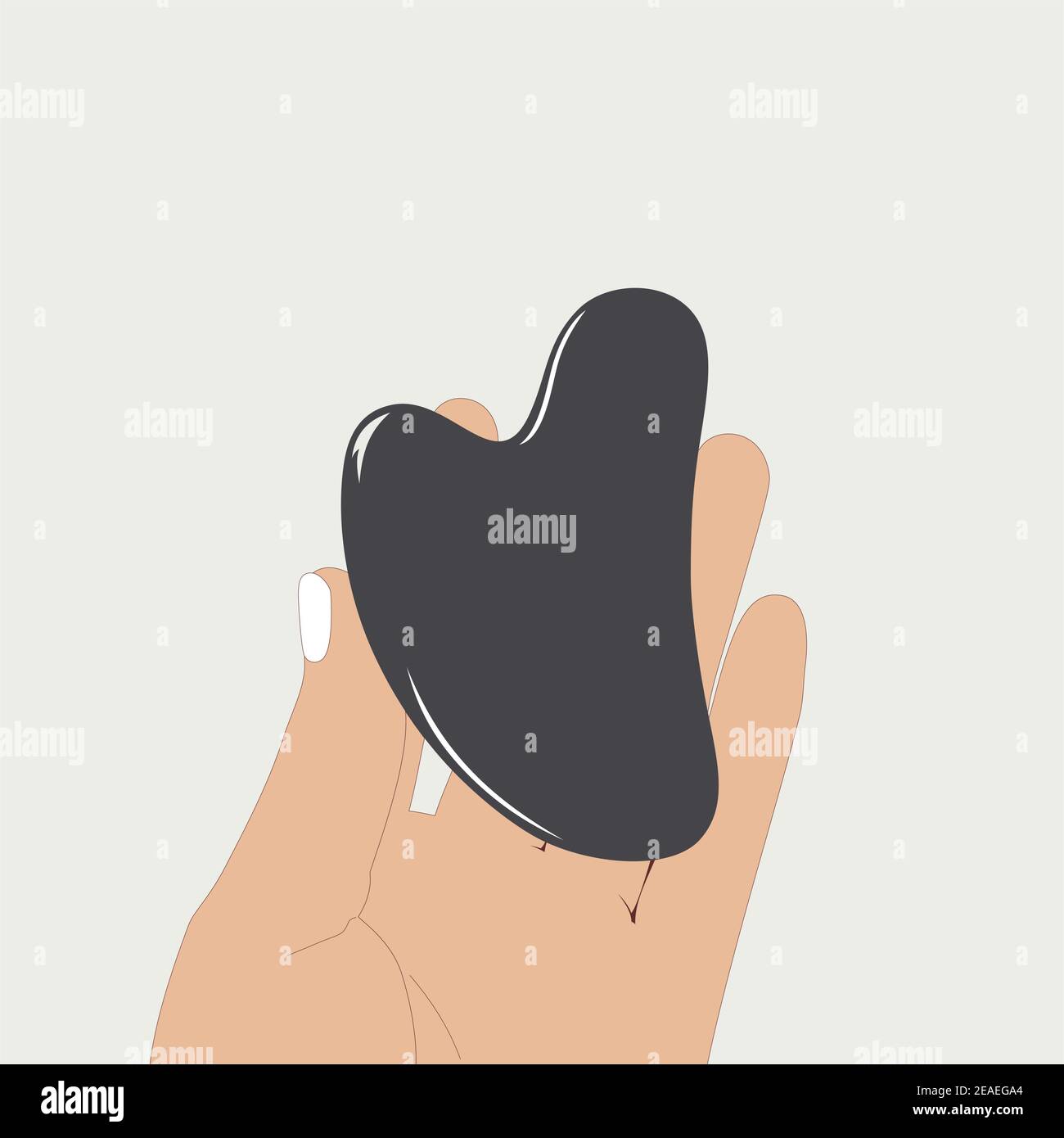 Hand holding Gua Sha massage tool. The Black Obsidian Facial Lifting ...
