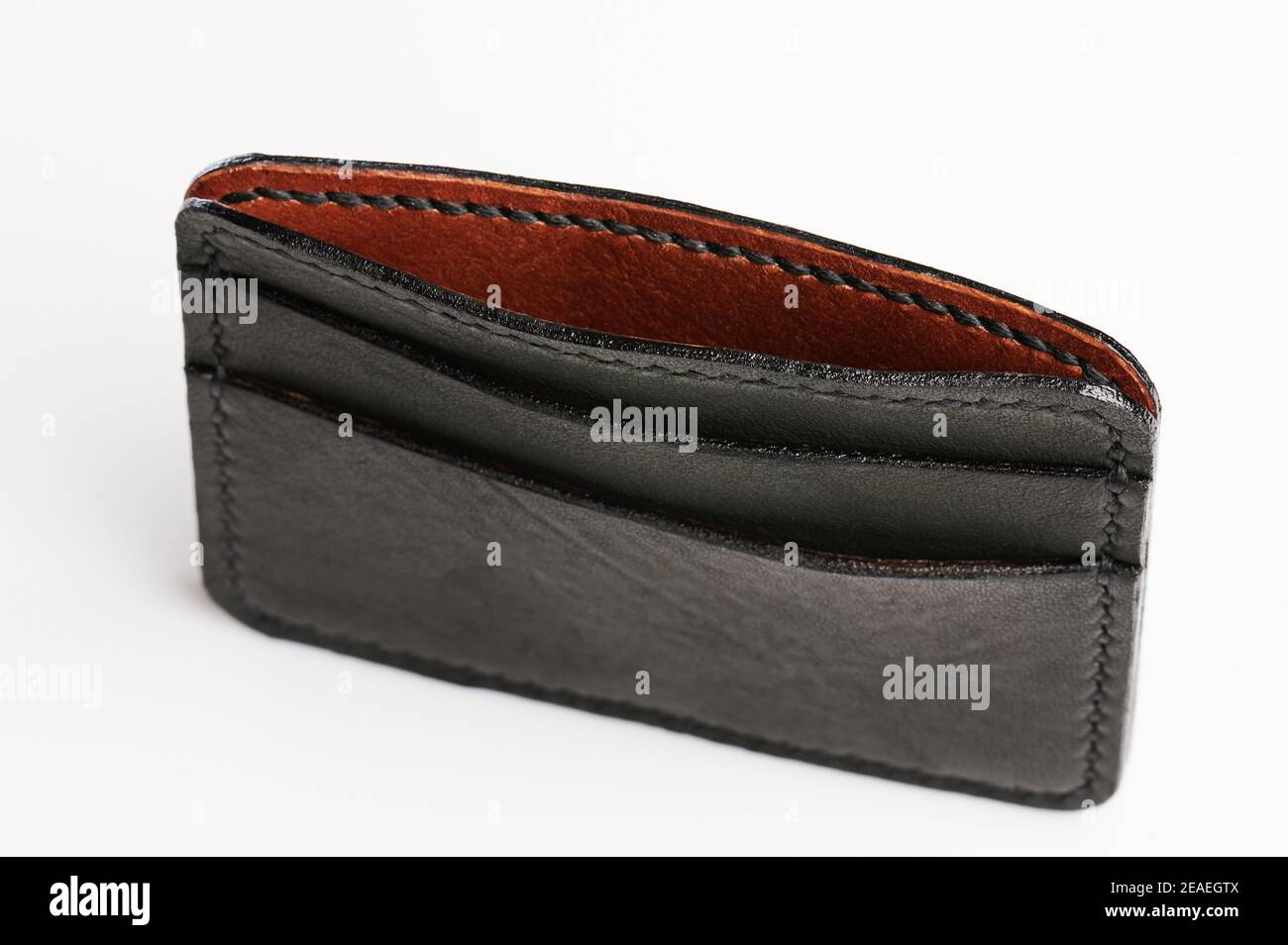 Open black leather card wallet above top view isolated Stock Photo - Alamy