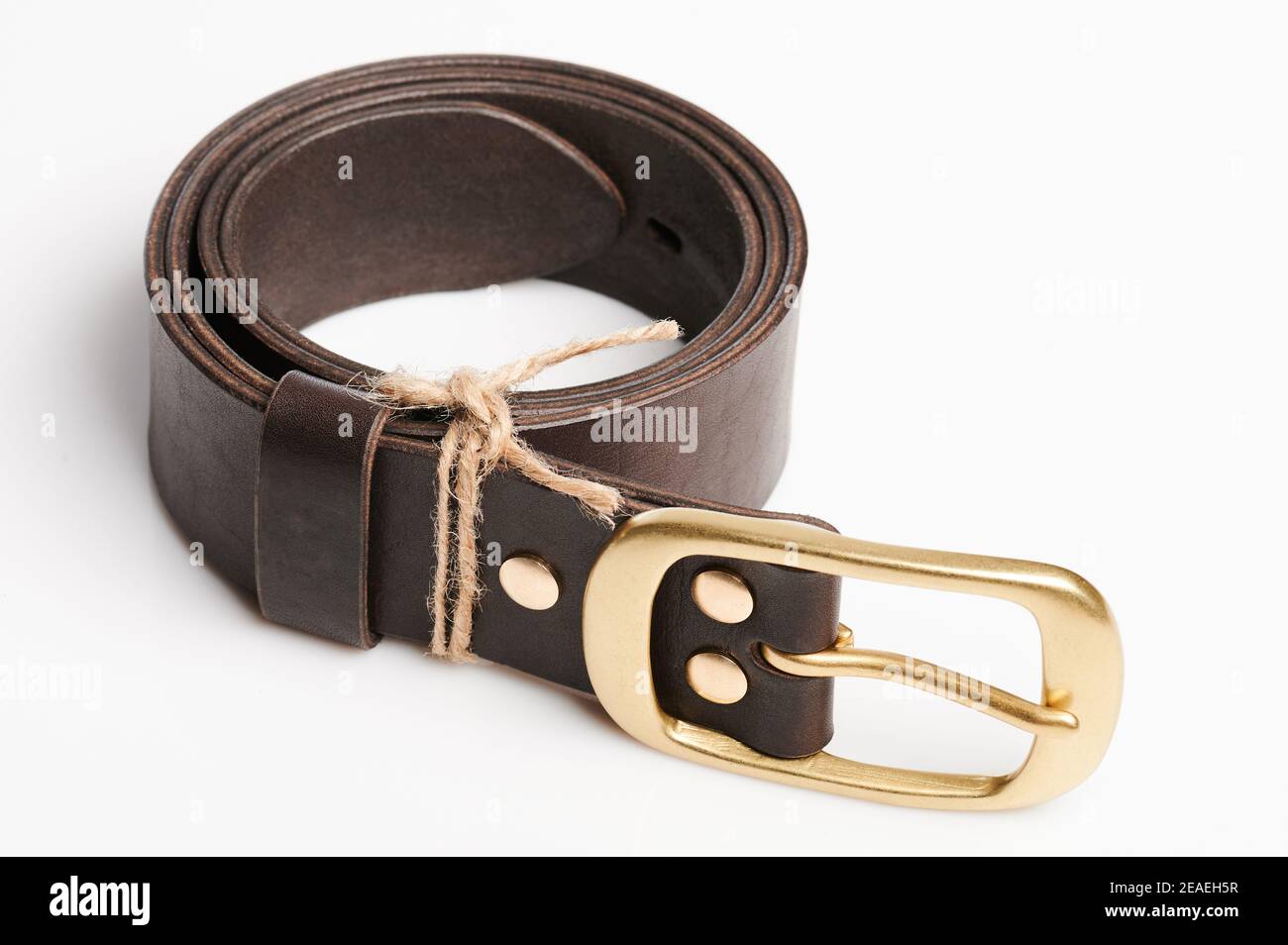 Round shape brown leather belt isolated on white background Stock Photo ...