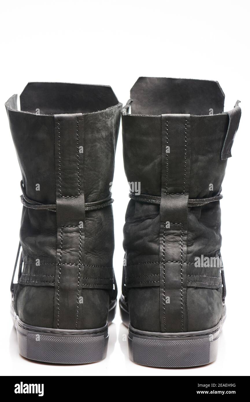 Back of black leather shoes isolated on studio background Stock Photo ...