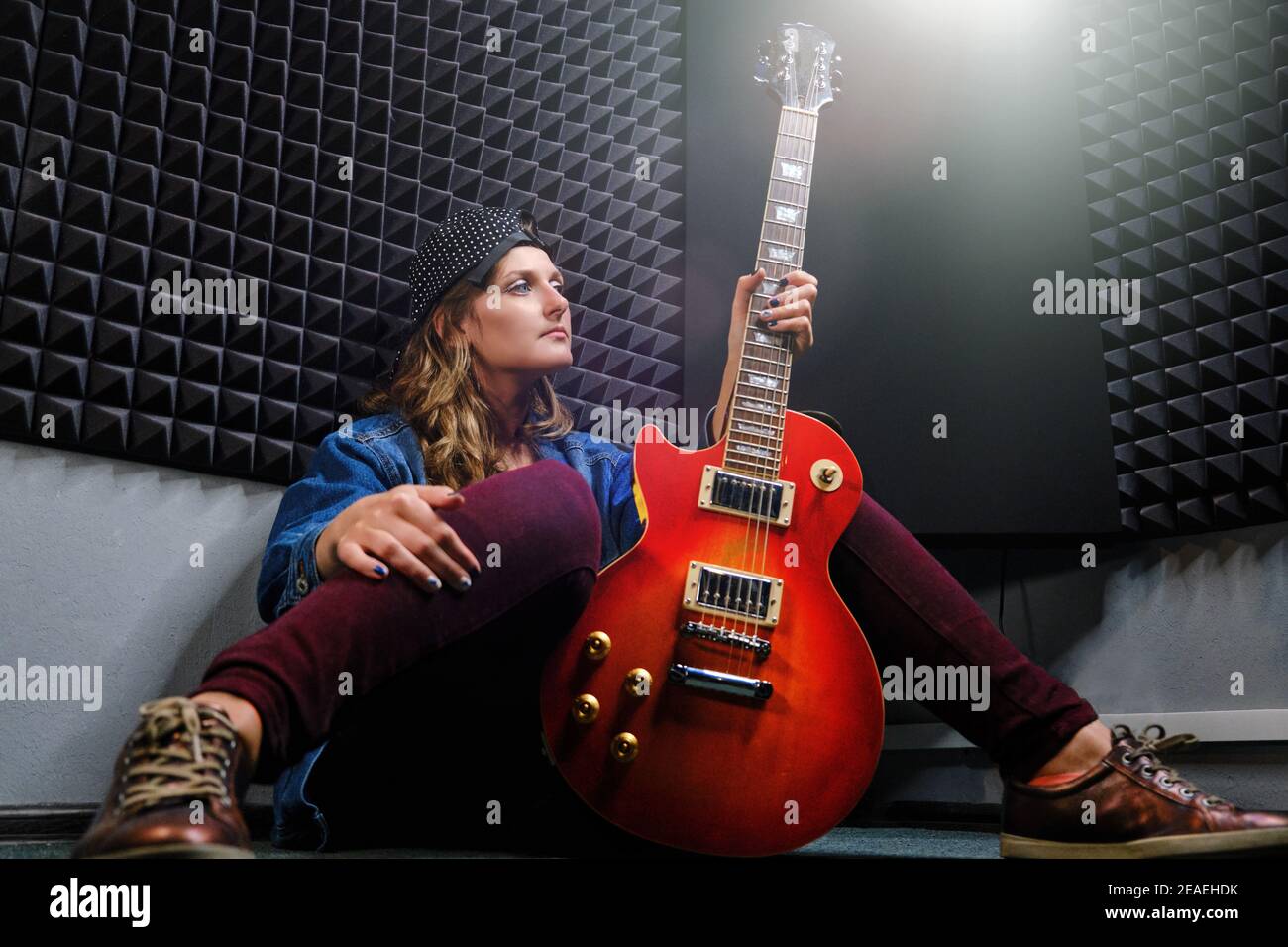 Professional recording of musical instruments in the Studio. The woman ...