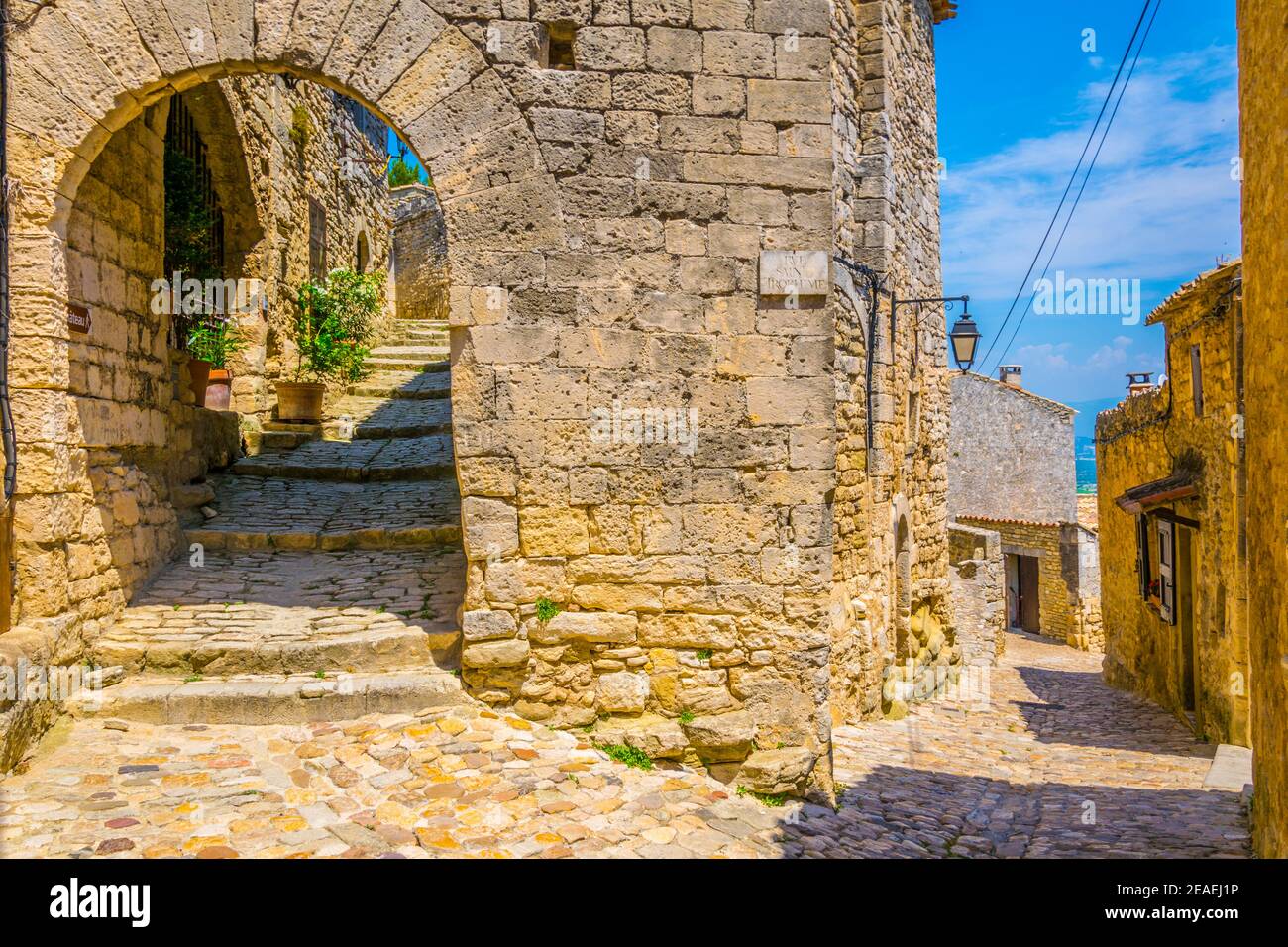 Narrow street in Lacoste village in France Stock Photo - Alamy