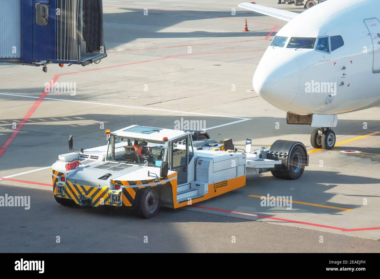Towing a passenger plane using special equipment for aircraft ...