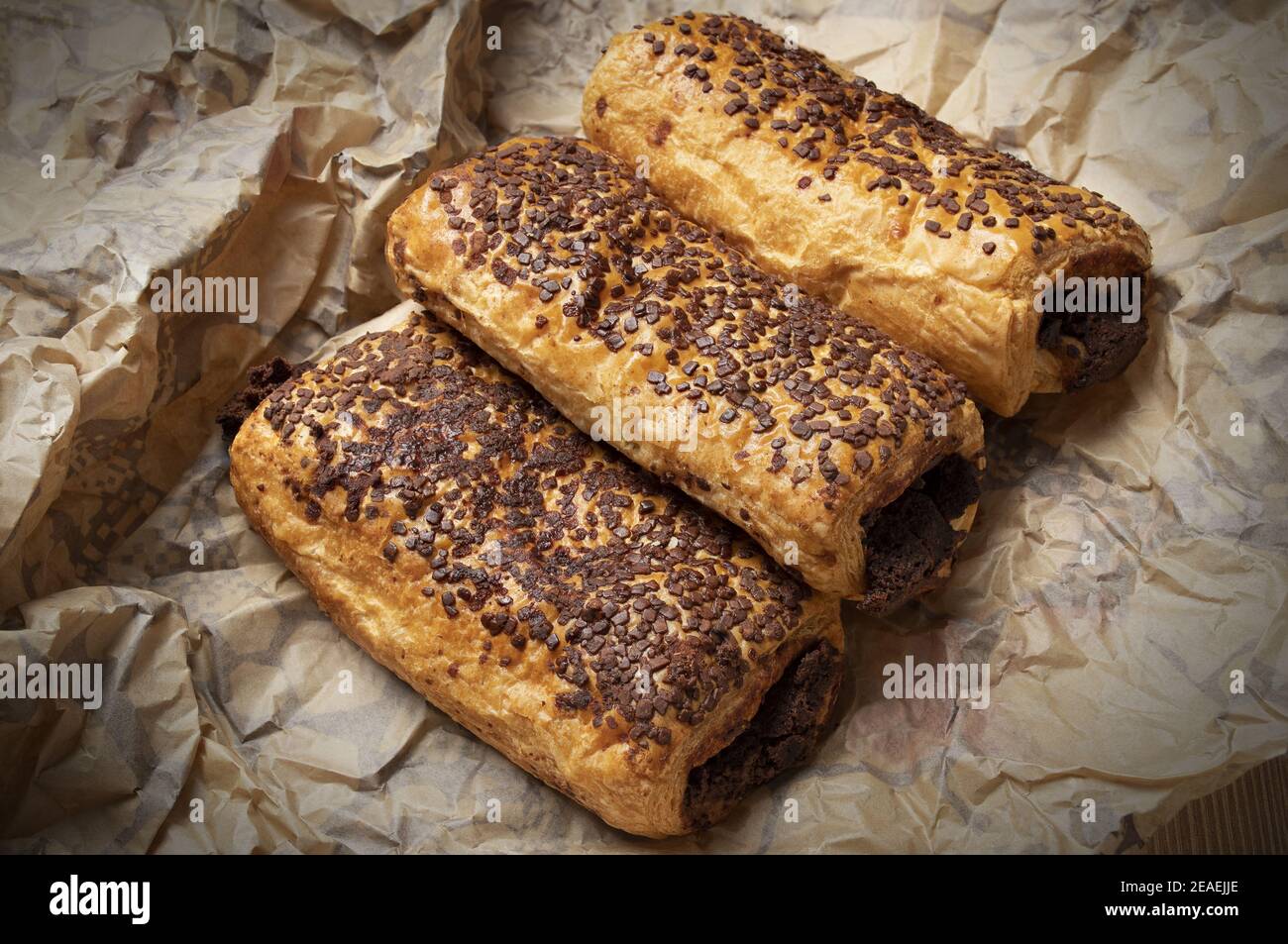 Tree Neapolitan chocolate on brown paper and wood Stock Photo - Alamy