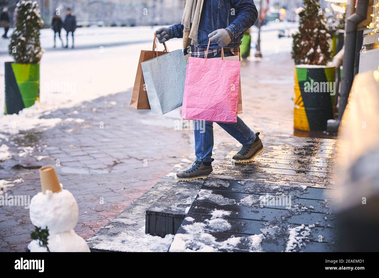 Stylish man going shopping in winter outdoors Stock Photo - Alamy