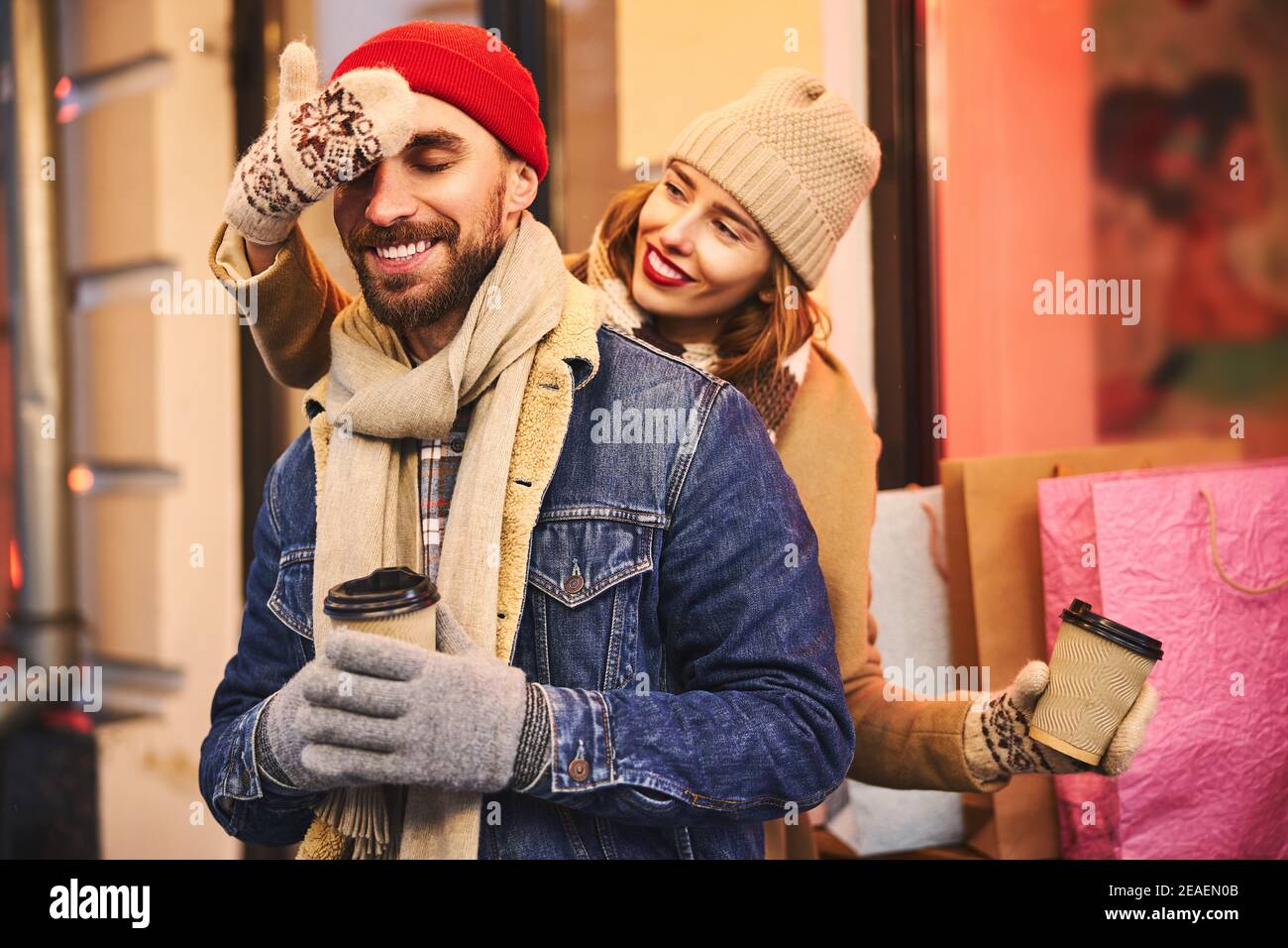 Jolly bearded guy drinking coffee with girlfriend outdoors Stock Photo ...