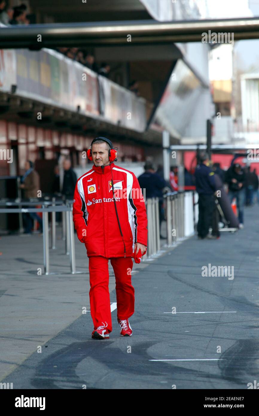 Ferrari Formula One team mechanic walking along the pit lane during pre ...