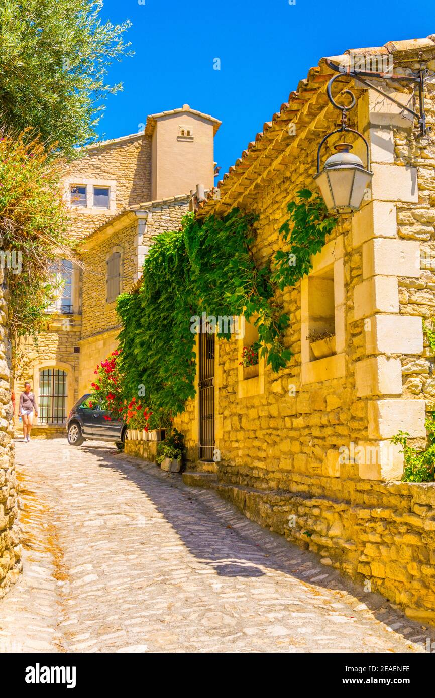 Narrow street in Gordes village in France Stock Photo - Alamy