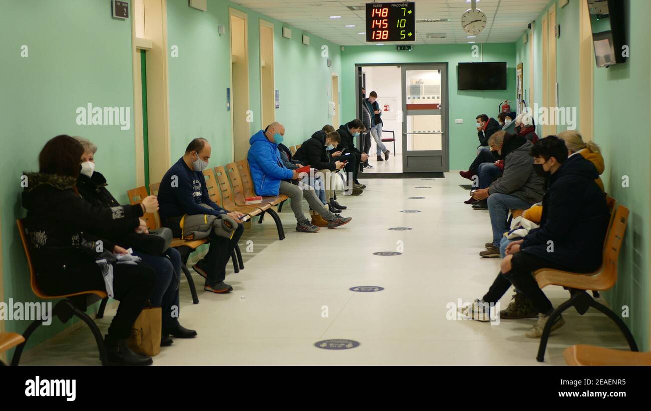 People are waiting in the waiting room at the office of the City Hall ...