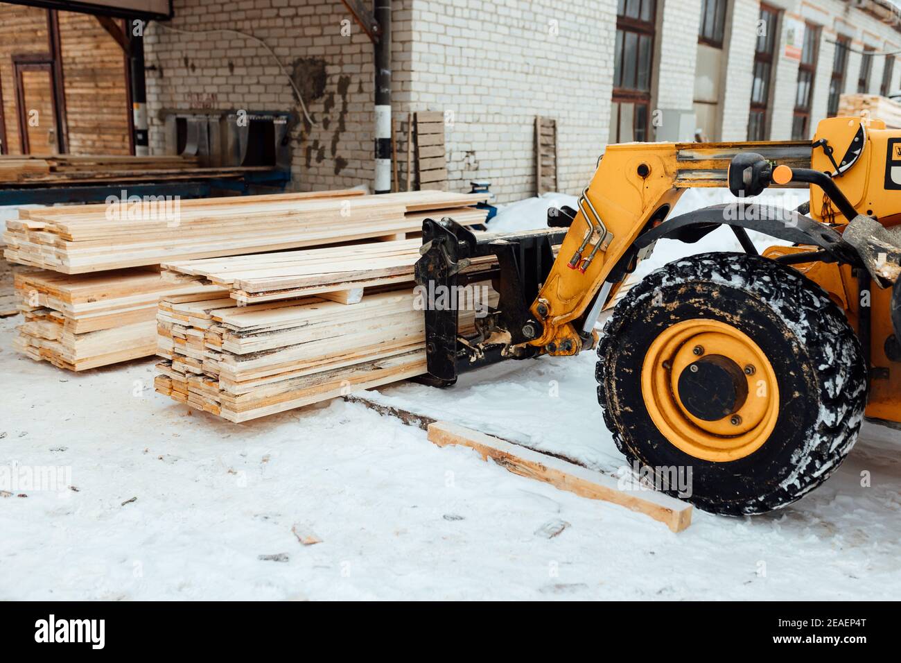 forklift truck with planks, delivery of wood to the warehouse, loading ...